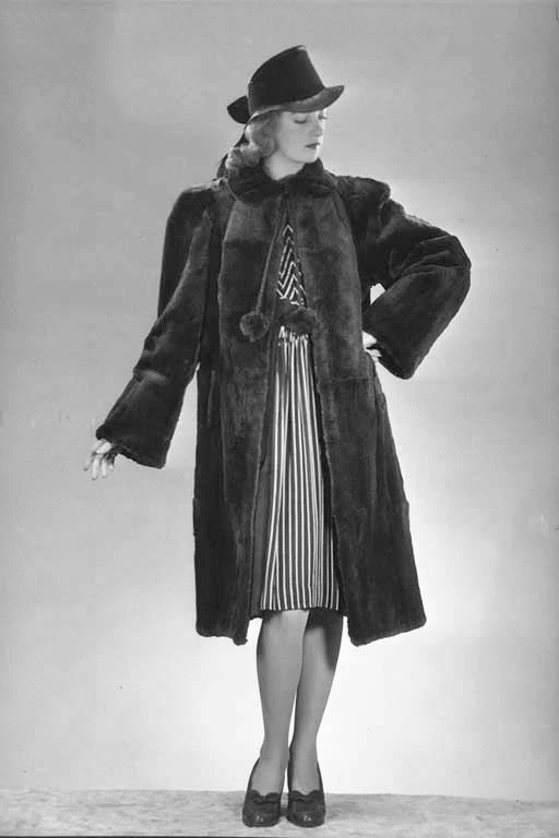Full length portrait of a model wearing a full length fur coat and hat, for Mooney Furs | Record ...