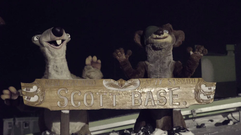 Sid and Buck at the Scott Base sign | Record | DigitalNZ