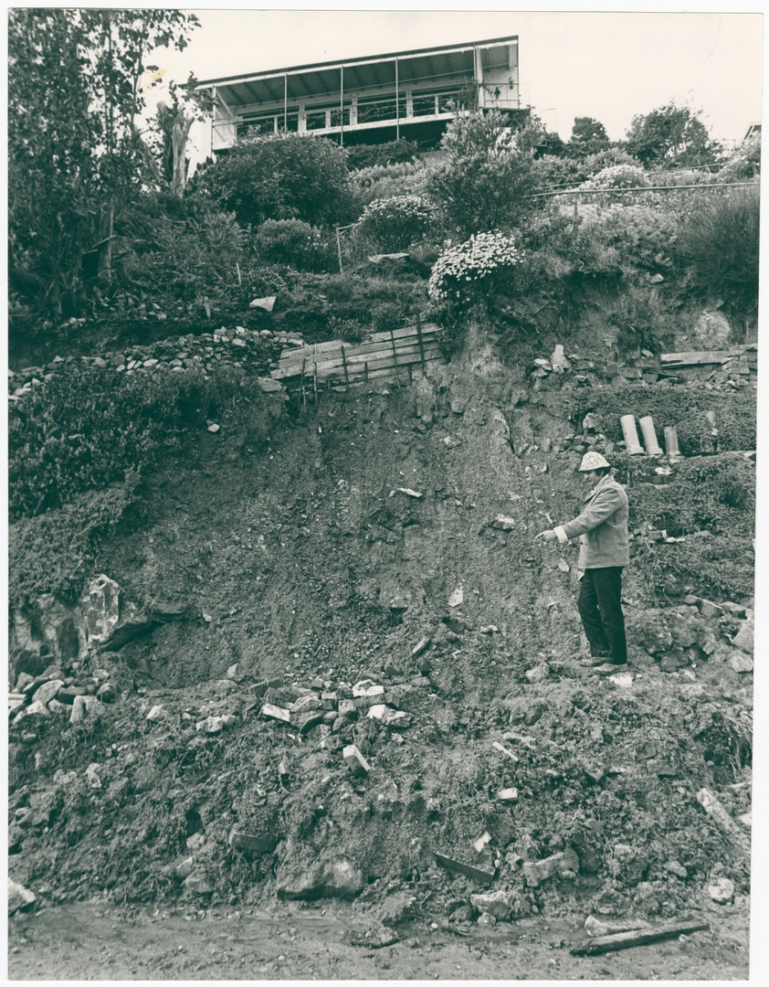 A collapsed bank beneath a house | Record | DigitalNZ