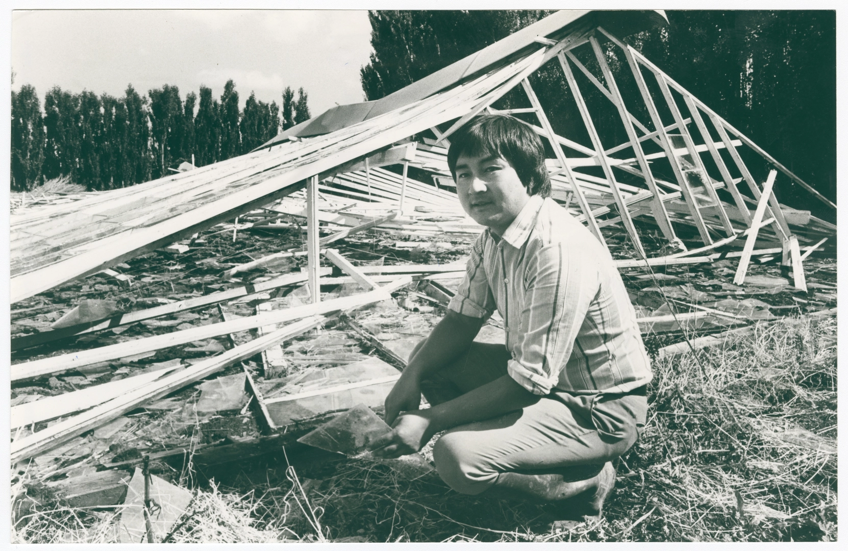 David Yee with his tornado damaged glass house | Record | DigitalNZ