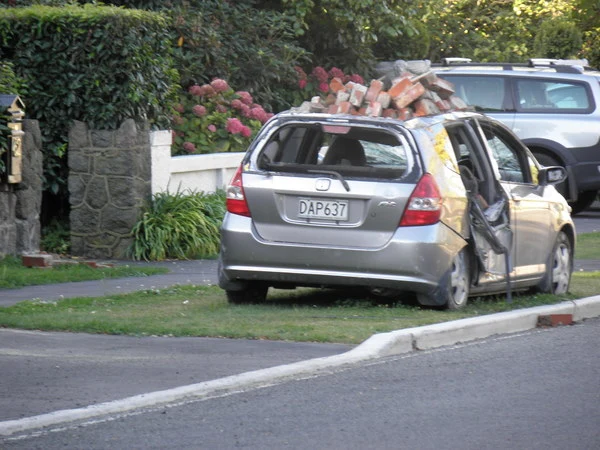 Vehicle damaged by falling masonry | Record | DigitalNZ