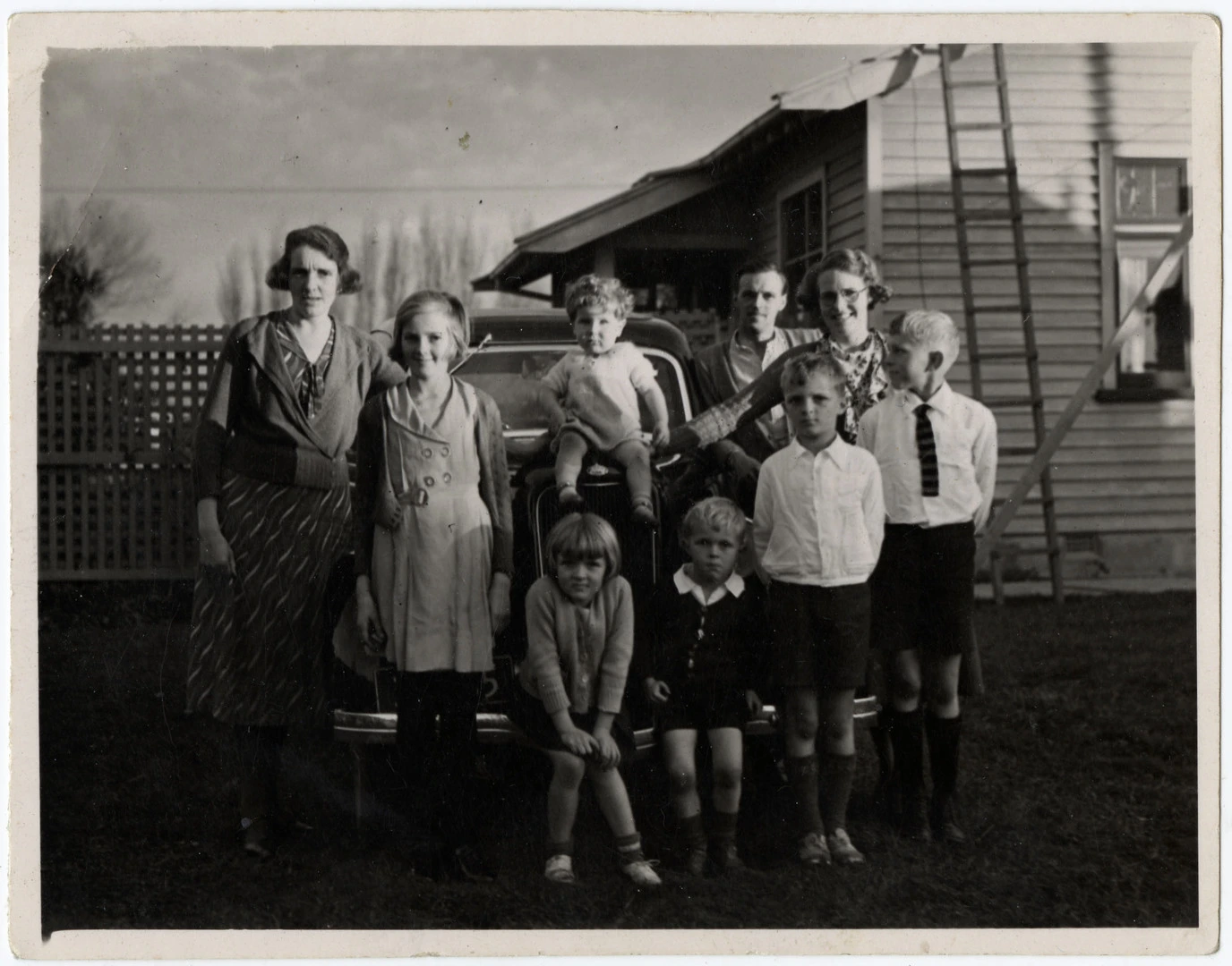 Macefield family with the Hodgkinsons on a vintage car | Record | DigitalNZ