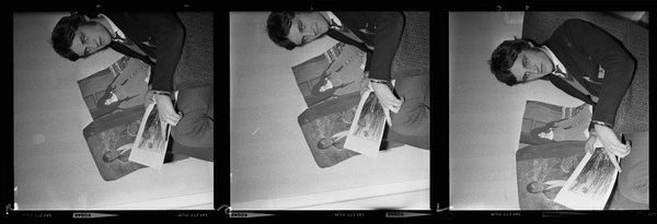 Grant Gallagher sitting with art | Record | DigitalNZ