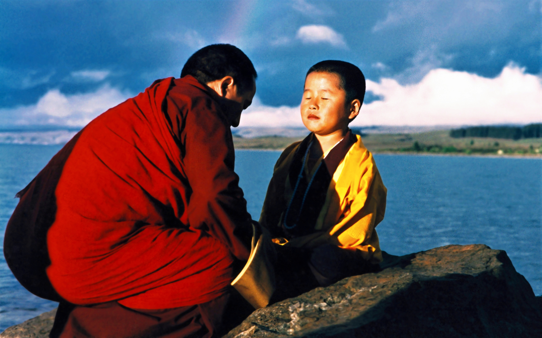 Pong Re Tulku Rinpoche sitting on lakeside rock | Record | DigitalNZ
