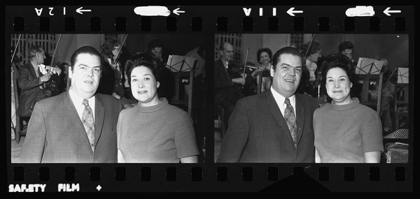 John Mitchinson and Maureen Guy in front of orchestra | Record | DigitalNZ