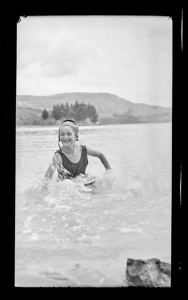 Doreen Vinicombe splashing in water | Record | DigitalNZ