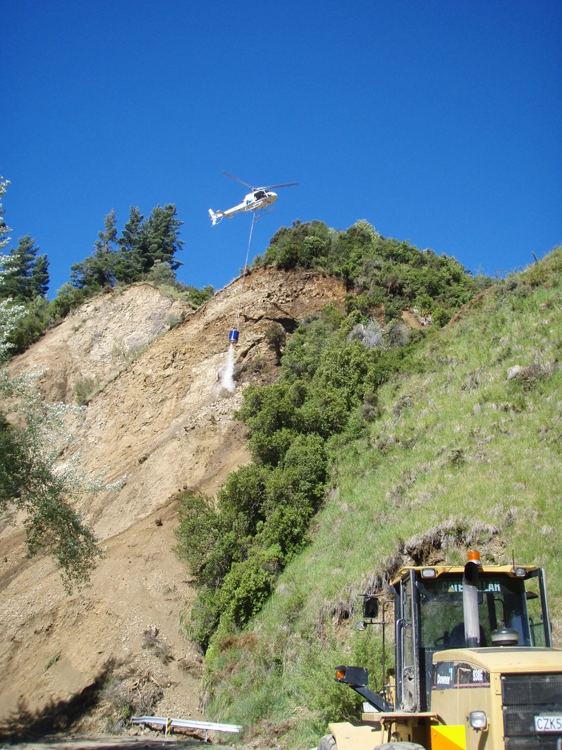 Helicopter sluicing landslide, Whalesback Farm | Record | DigitalNZ