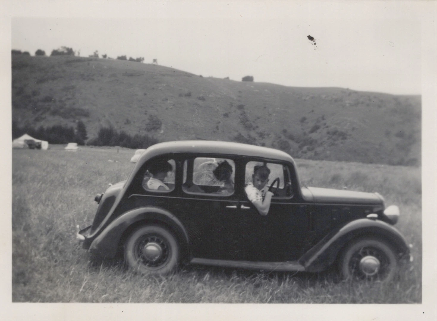 Robin Buchan driving his Austin 10 to a picnic at Okains Bay | Record | DigitalNZ