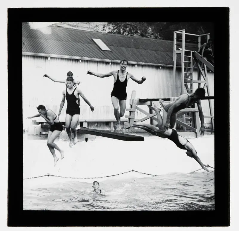 Unidentified people jumping off a diving board | Record | DigitalNZ