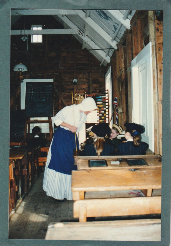 Prue Lees (teacher) with children at their desks in Ararimu Valley ...
