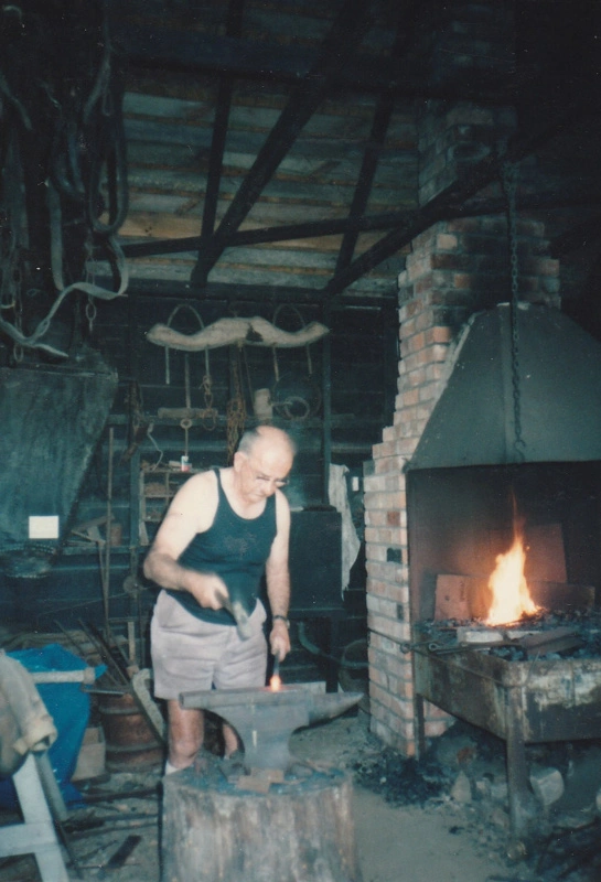 Stan Butler at work in Wagstaff's Forge in Howick Historical Village. | Record | DigitalNZ