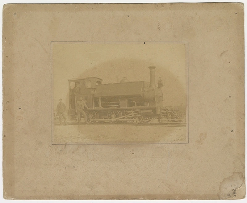 Photograph, Three men with locomotive | Record | DigitalNZ