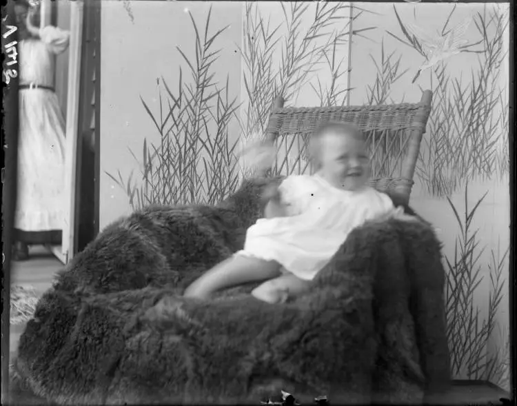 Dolly Vaile seated in a fur rug, 1910 | Record | DigitalNZ