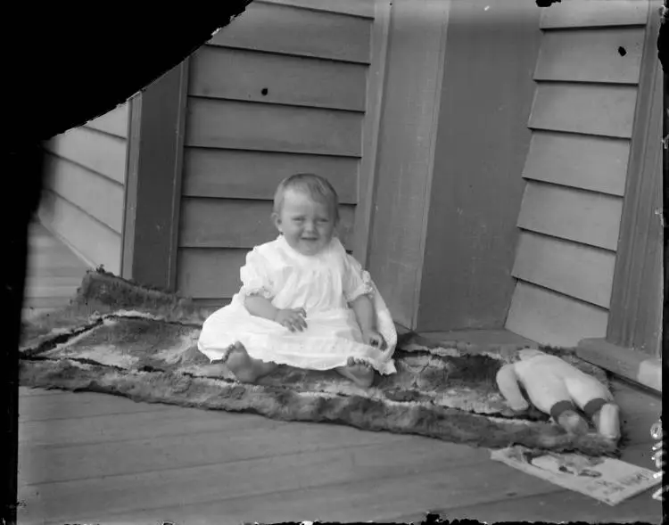 Dolly Vaile seated on a fur rug, 1910 | Record | DigitalNZ