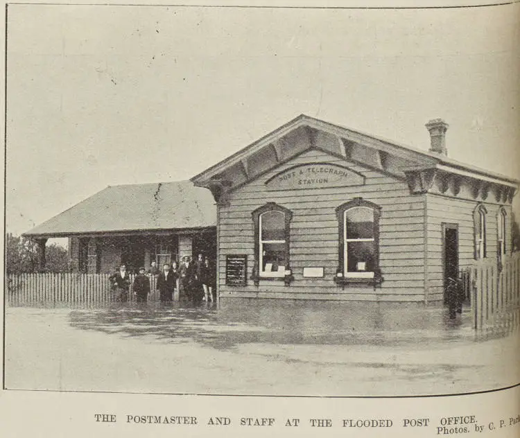 The postmaster and staff at the flooded Post Office | Record | DigitalNZ