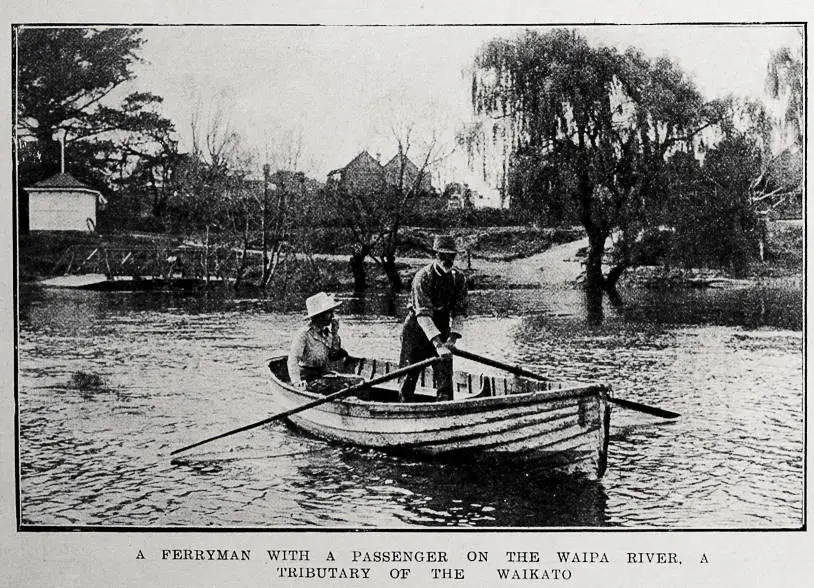 A ferryman with a passenger on the Waipa River, a tributary of the ...