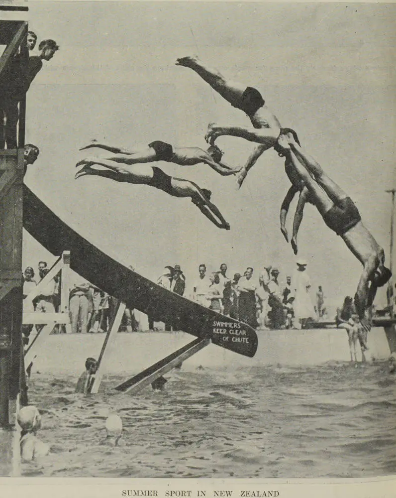 Boys diving from the platforms at the Milford swimming pool in Auckland | Record | DigitalNZ