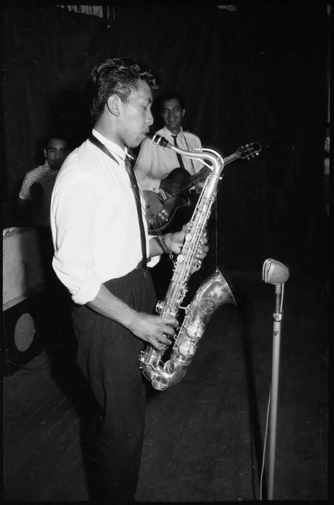 Marsh Cook on stage with the Quin Tikis at the Māori Community Centre ...