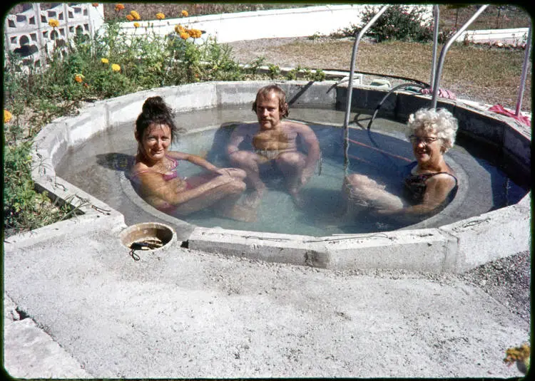 Sandy, Bill and Alethea Rowntree in a spa pool, 1970 | Record | DigitalNZ