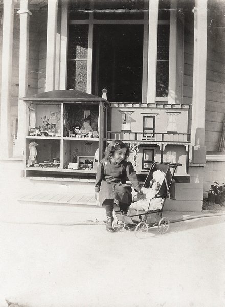 Marjorie Gray with dolls-house: photograph | Record | DigitalNZ