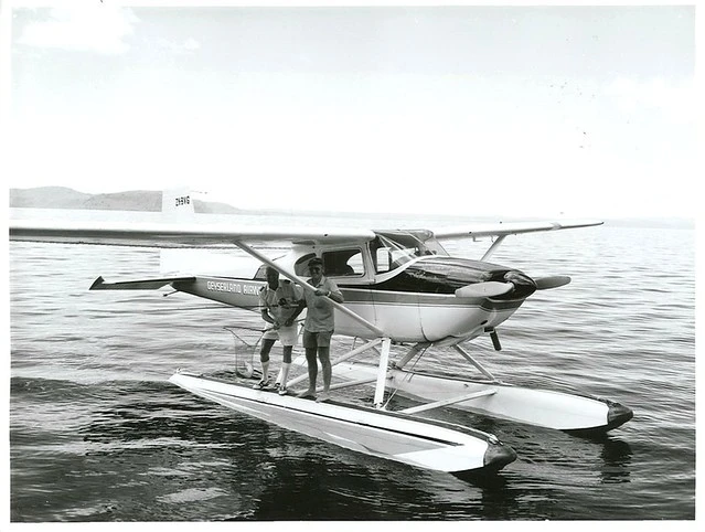 Captain Fred Ladd and Pat Burstall with fish caught while trolling from the float of the Cessna ...