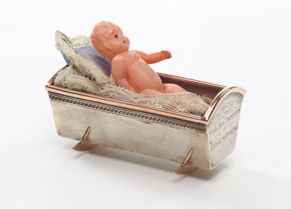 Presentation cradle with doll | Record | DigitalNZ