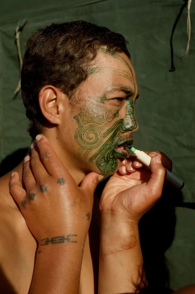 Young Maori man receiving marker-pen moko | Record | DigitalNZ