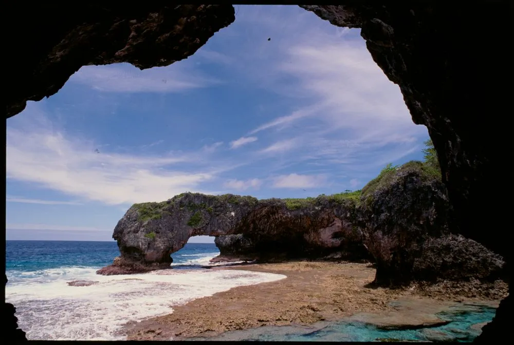View of beach through rocky archway, Niue | Record | DigitalNZ