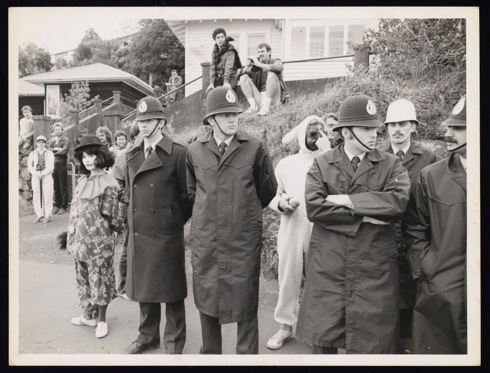 Protesters dressed as a clown and rabbit beside police during Springbok ...