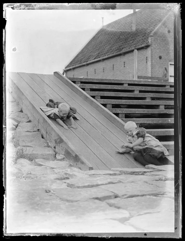 Two children sliding down a ramp, the Netherlands | Record | DigitalNZ