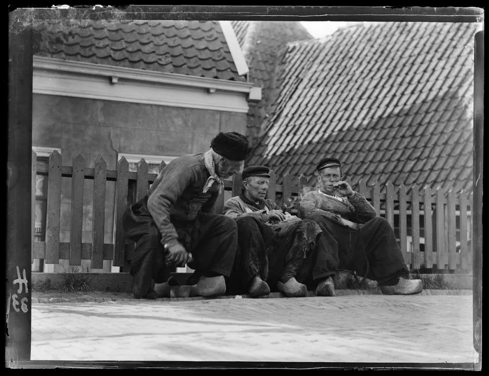 Three men sitting on street, the Netherlands | Record | DigitalNZ