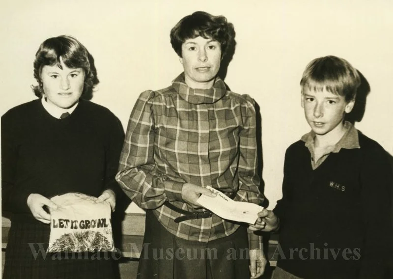 Two school children and woman during cheque presentation | Record | DigitalNZ