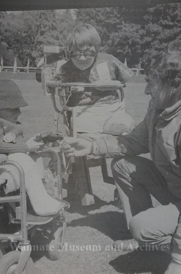 Man with two children in wheelchairs | Record | DigitalNZ