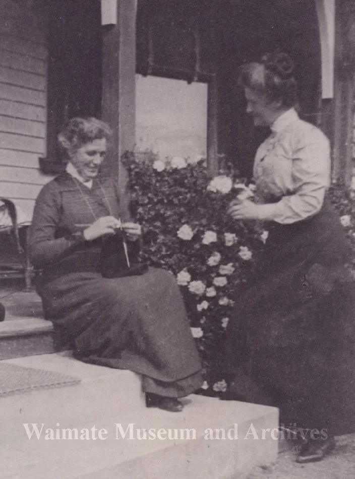 Dr Margaret Cruickshank and Mrs Barclay sitting on steps and knitting ...